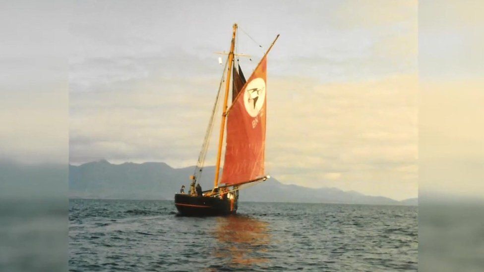 Century-old Devon fishing boat sets sail after restoration - BBC News