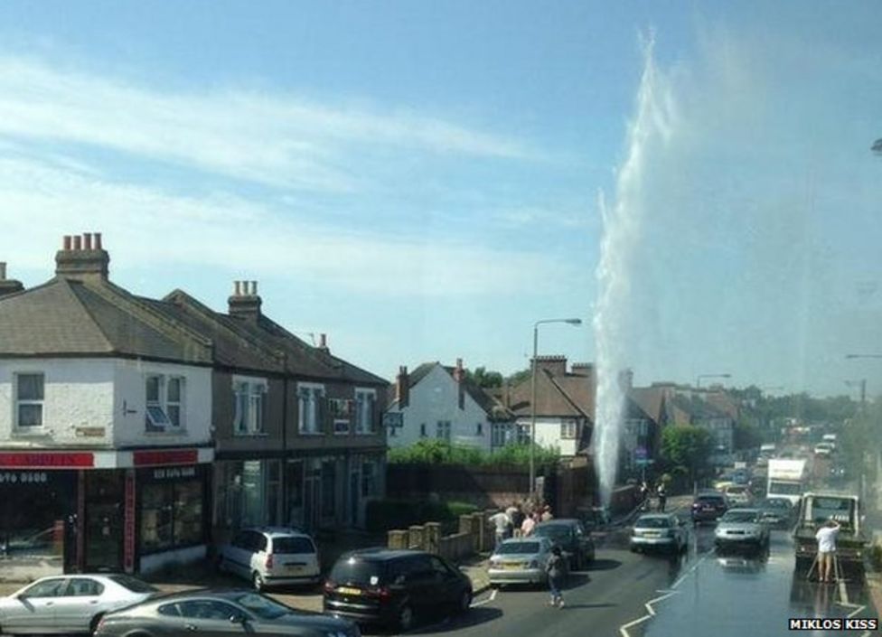 Tooting pipe burst sends water 50ft high into sky - BBC News