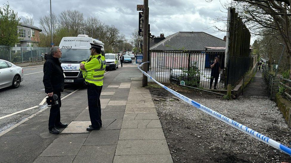 Salford murder inquiry after human torso found in woodland - BBC News