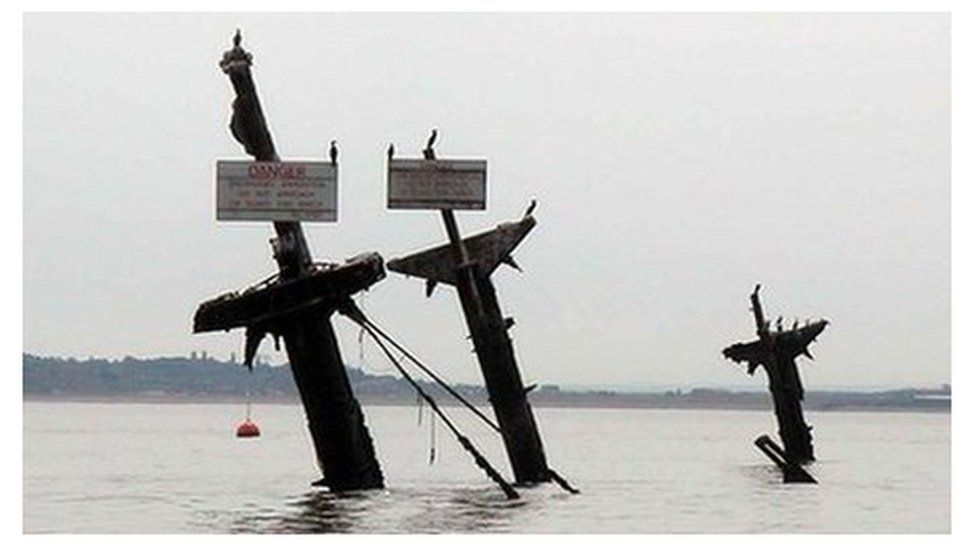Masts to be cut from Thames Estuary wreck packed with explosives - BBC News