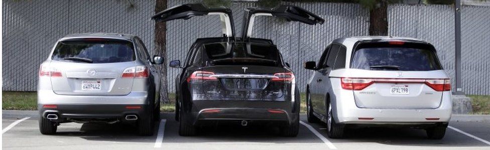 Tesla unveils Model X car with Falcon Wing doors - BBC News