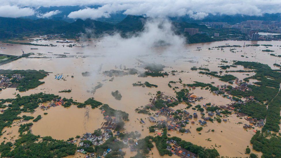 China floods: Thousands moved to safety after heavy rainfall - BBC ...