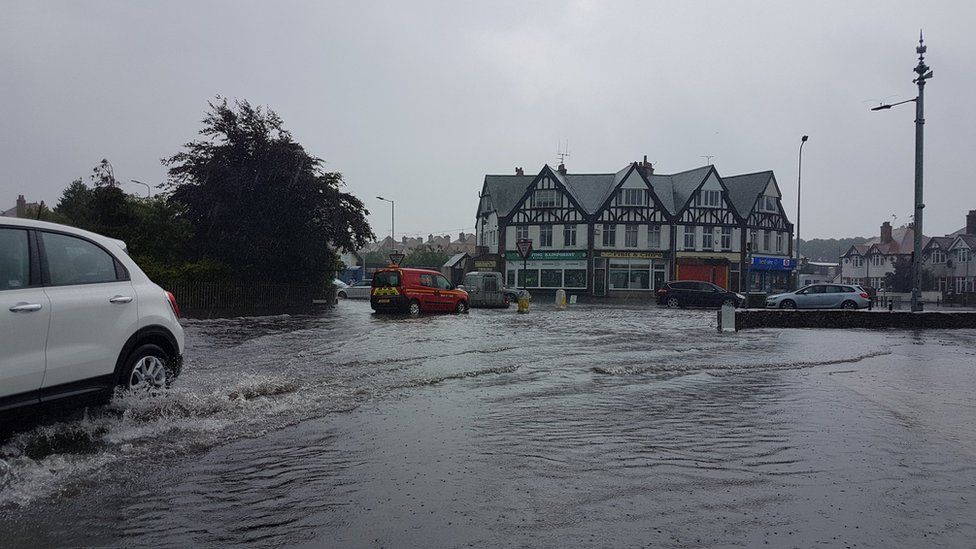 Flood damage after severe storms hit north Wales - BBC News