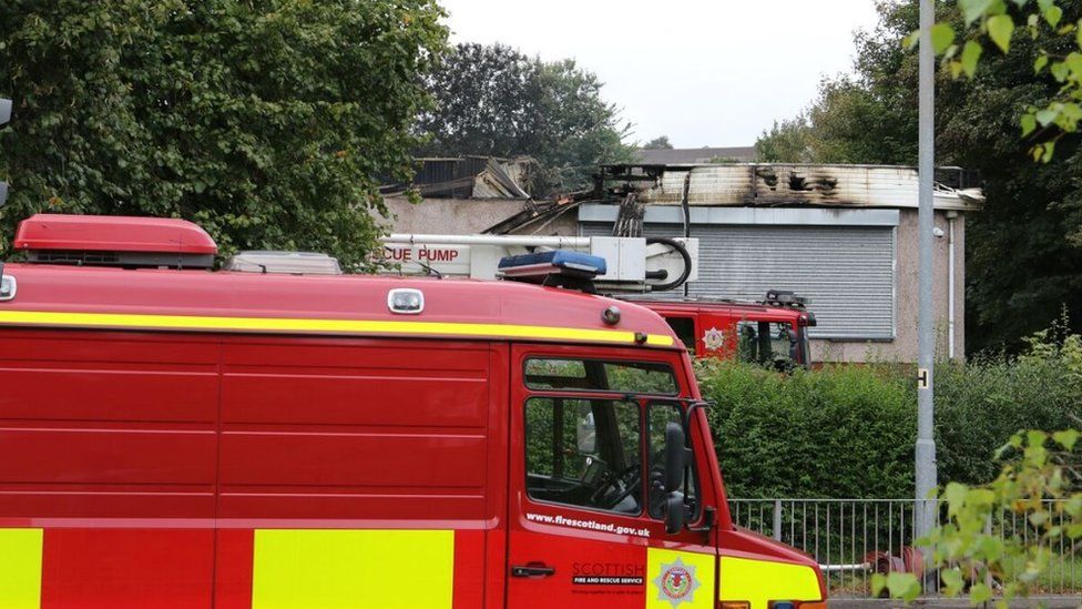 Firefighter badly hurt tackling blaze at Greenock building - BBC News