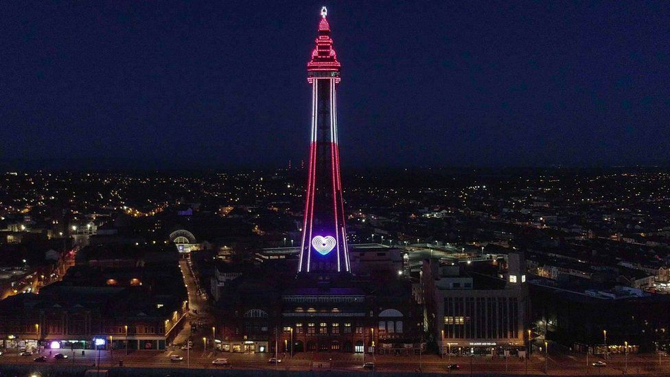 Blackpool Tower bathed in red and white for Hindu celebration - BBC News
