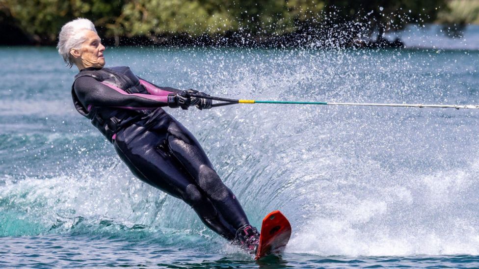 Woman marks 80th birthday with waterski slalom - BBC News