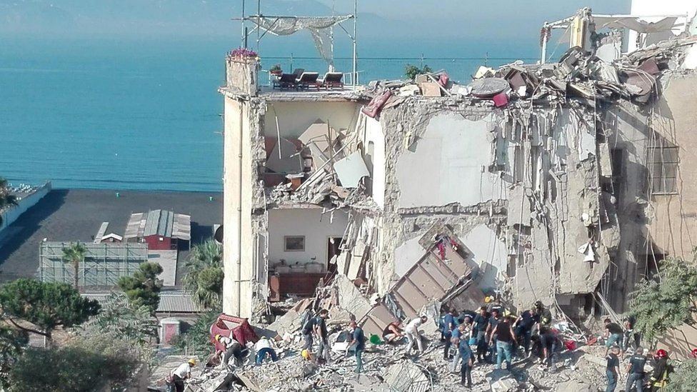 Naples building crumbles - eight missing - BBC News