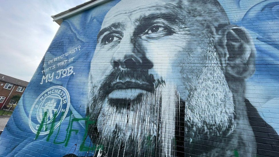 Anger as Pep Guardiola mural defaced with 'MUFC' - BBC News