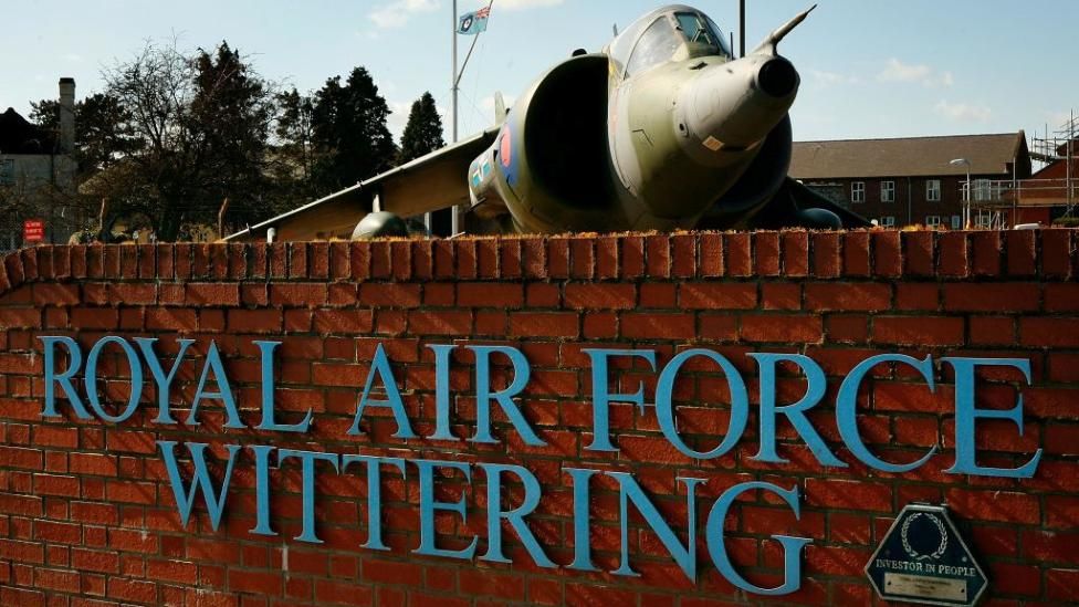 Lorry driver dies after collision outside RAF Wittering - BBC News