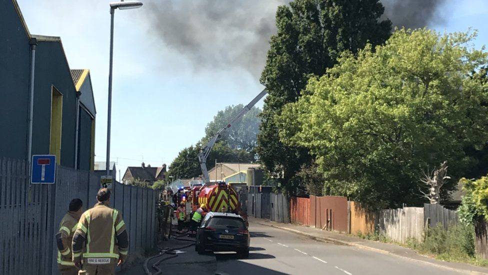 Firefighters tackle Wisbech wood warehouse blaze - BBC News