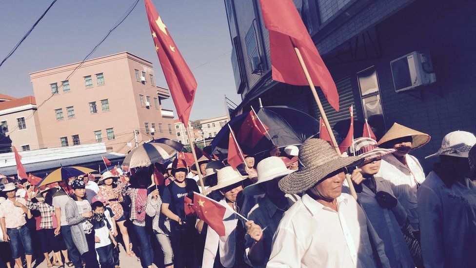 Wukan's 'rebel' villagers take to streets in ongoing protest - BBC News