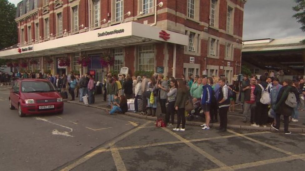 Devon train line re-opens after rockfall - BBC News