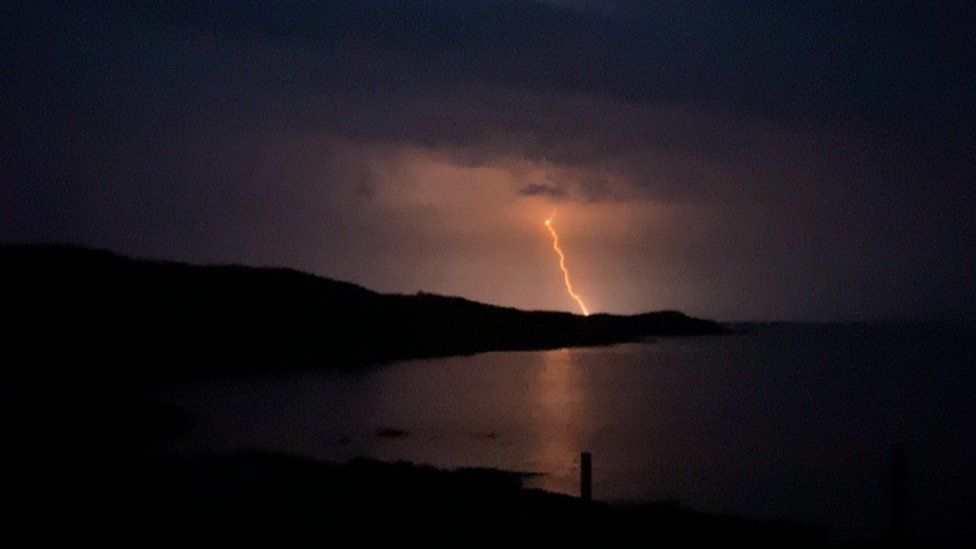Railway line and road damaged during thunderstorms - BBC News