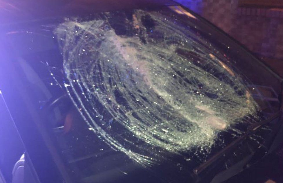 Man pulled over for driving with shattered windscreen - BBC News