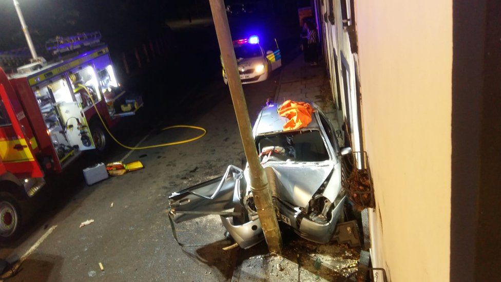 Car crashes into lamp-post outside couple's Treharris home - BBC News