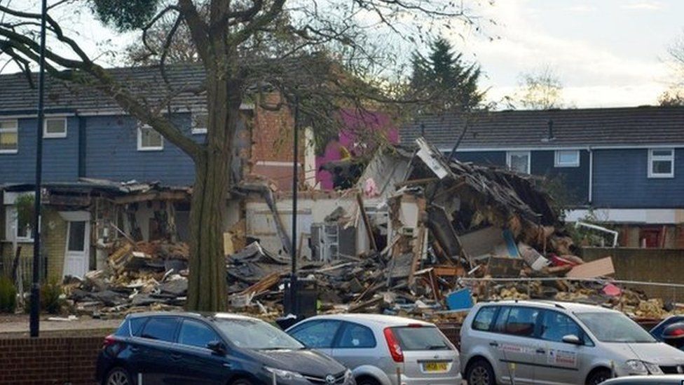 Gas explosion family return to rebuilt home - BBC News