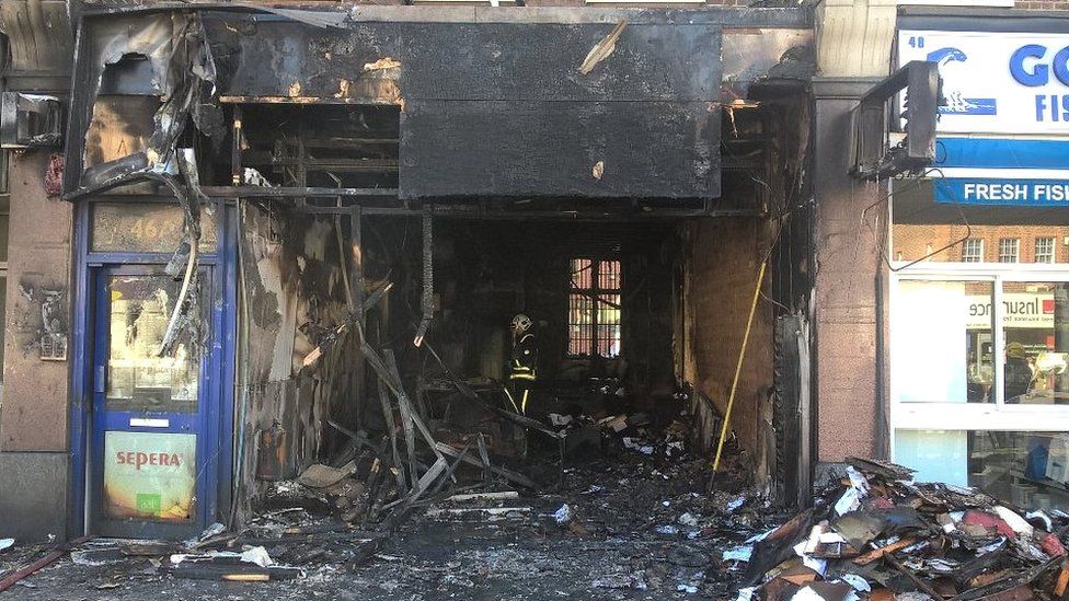 Driver flees after car smashes into Harrow shop and bursts into flames ...