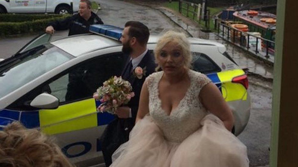 Stranded bride and groom given police escort after Burnley crash - BBC News