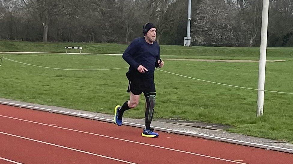 Dad running 120 laps of Peterborough track in aid of son's school - BBC ...