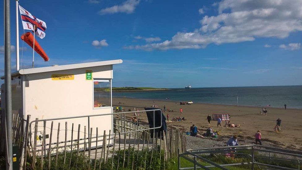 Cranfield beach jet ski rescue as teen's lilo swept to sea - BBC News