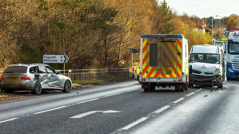 Two injured in patient transfer ambulance crash near Lhanbryde - BBC News