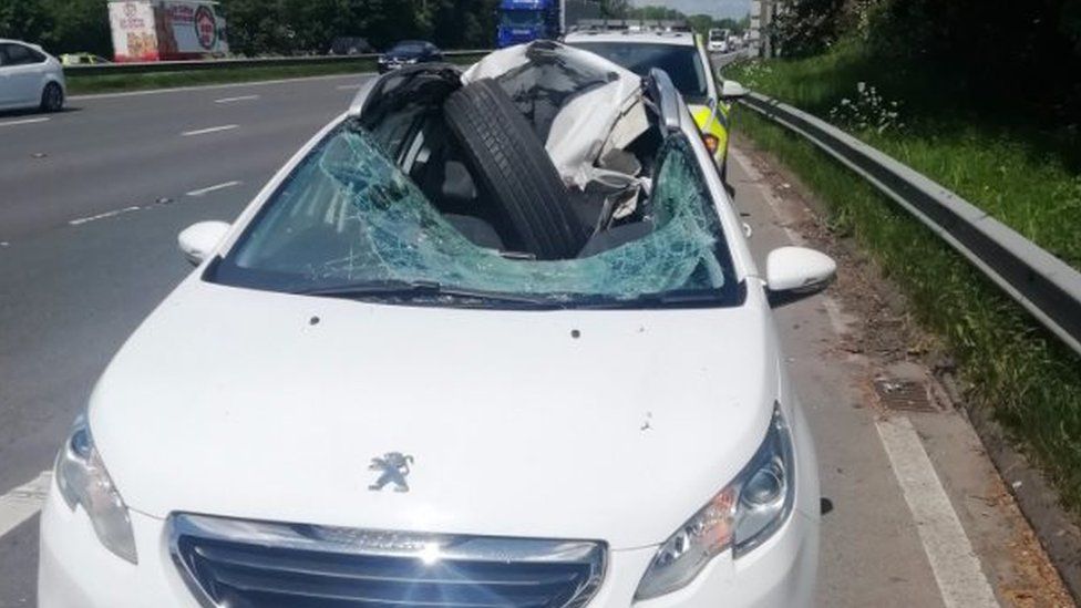 Loose lorry wheel smashes into car on M6 in Leyland - BBC News
