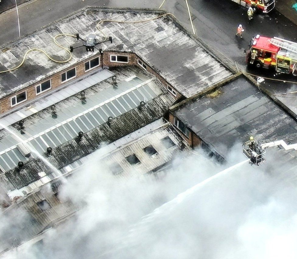 Crews remain at Birmingham warehouse fire - BBC News