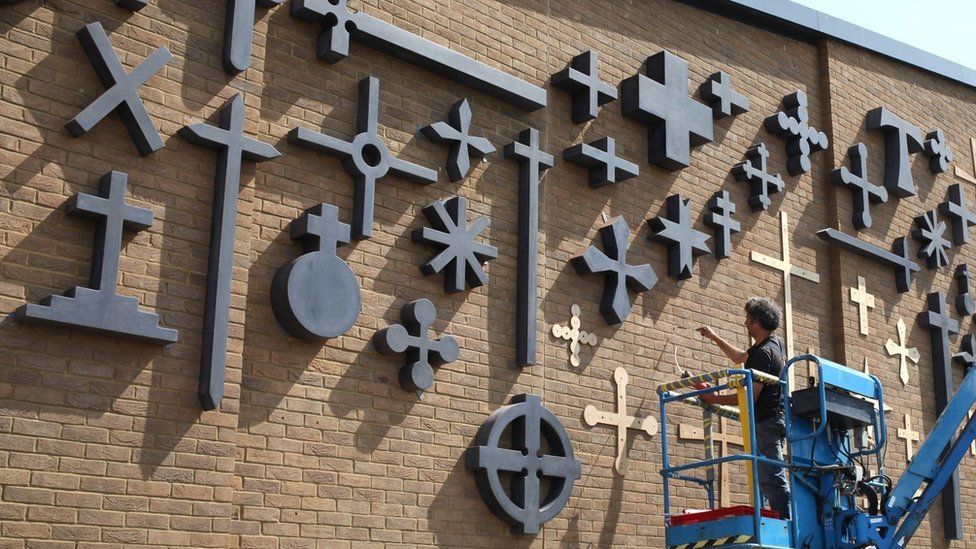 Artwork of 77 concrete crosses unveiled at Glasgow church - BBC News