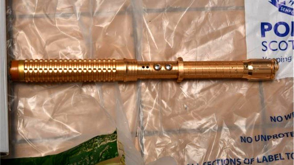 Convicted killer caught with stun guns is jailed - BBC News