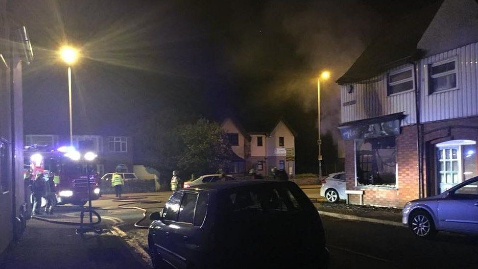 Beeston car and shop catch fire after taxi crash - BBC News