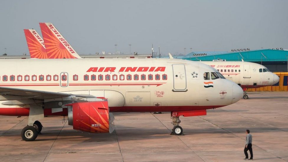 Air India: Plane stuck under bridge in viral video - BBC News