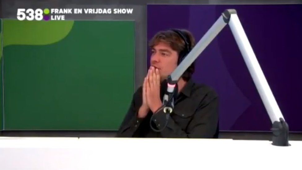 Dutch DJ 'sorry' over naked man prank on pop star Maan - BBC News