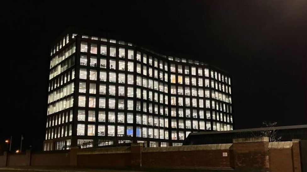 Criticism over government office 'lit up like Christmas tree' - BBC News