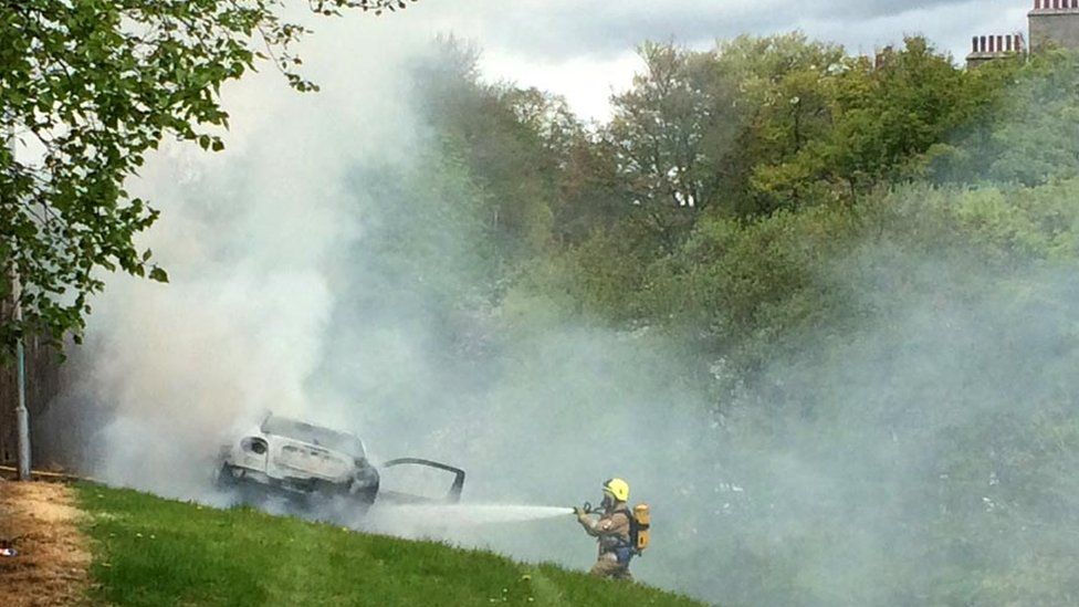 Burned-out car 'linked to stolen Aberdeen lorries' - BBC News