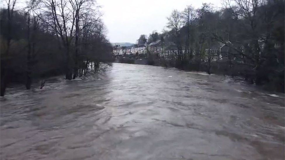 Wales flooding: Roads blocked and homes evacuated - BBC News