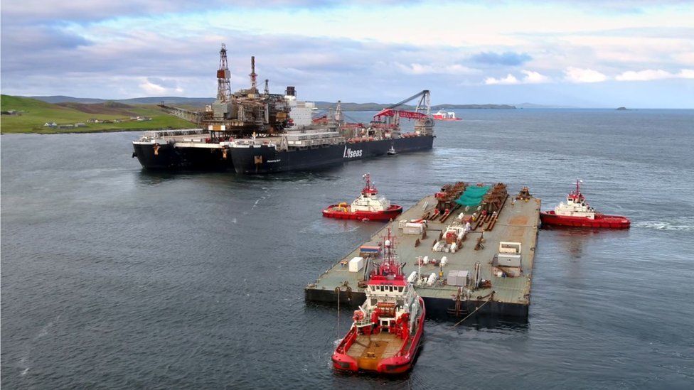 Ninian Northern: Giant oil platform's final voyage ends in Shetland ...