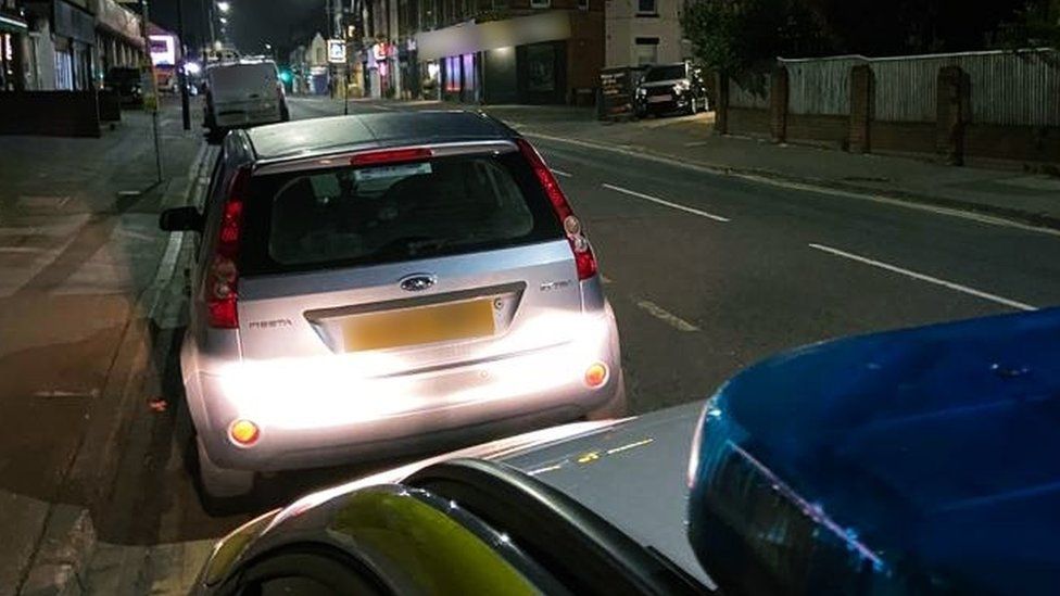 Driver stopped in Bournemouth while watching football on phone - BBC News