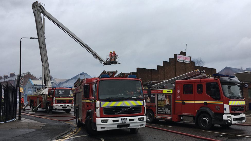 Fire rips through businesses in Old Trafford - BBC News