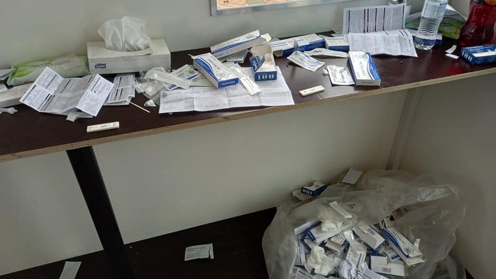 Shock at swabs and detritus left in NEC Covid test room - BBC News