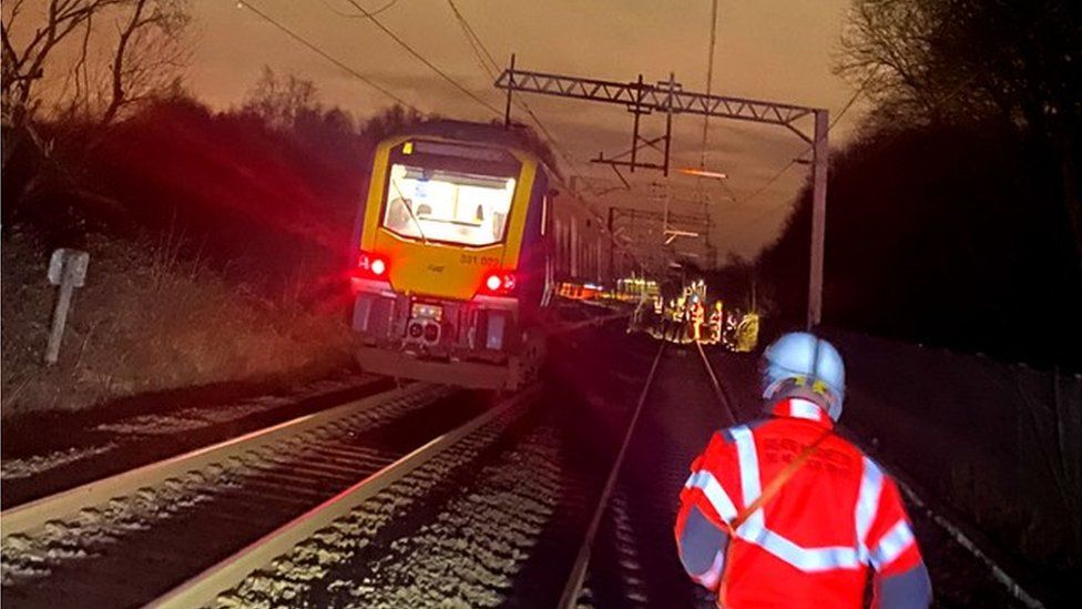 Fire breaks out after vandals hurl log at train - BBC News