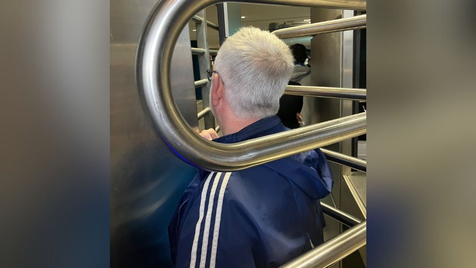 Peterborough fan trapped in Wembley turnstile photo goes viral - BBC News