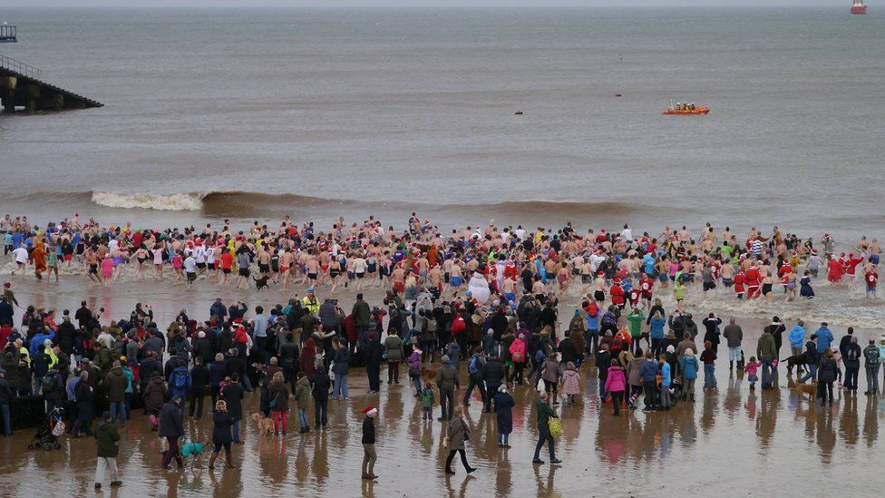 Christmas swims boosted by mild weather - BBC News