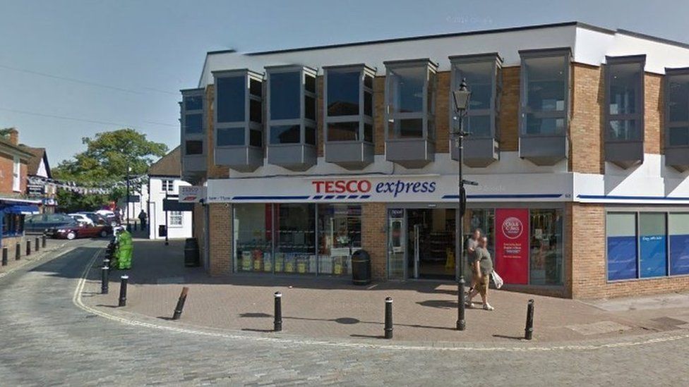 Masked men rob Burnham Tesco Express armed with sledgehammer - BBC News