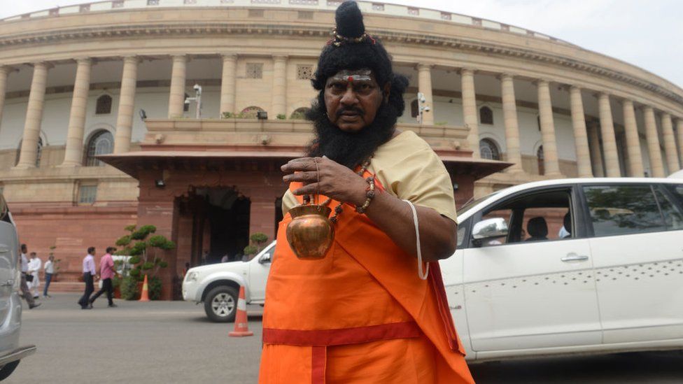 India MP shocks with Hitler costume protest in parliament - BBC News