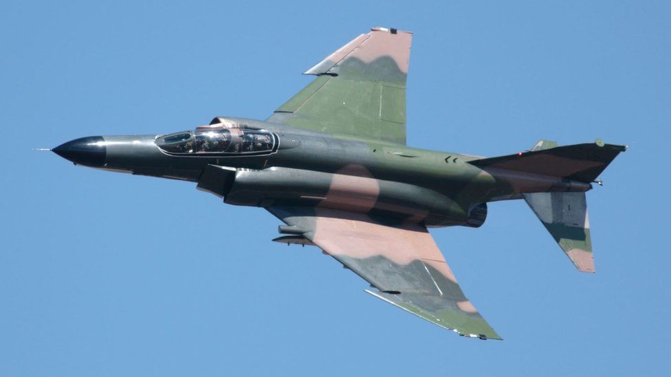 Model plane hit by train after Warrington railway line crash - BBC News