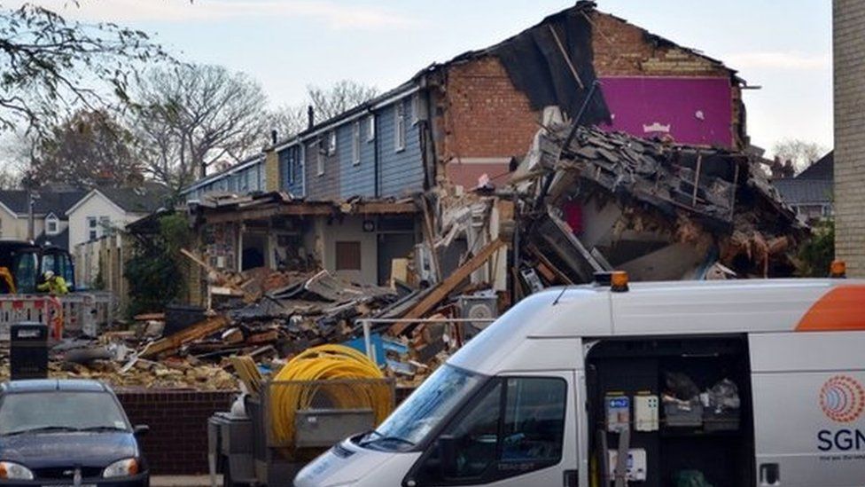 Gas explosion family return to rebuilt home - BBC News