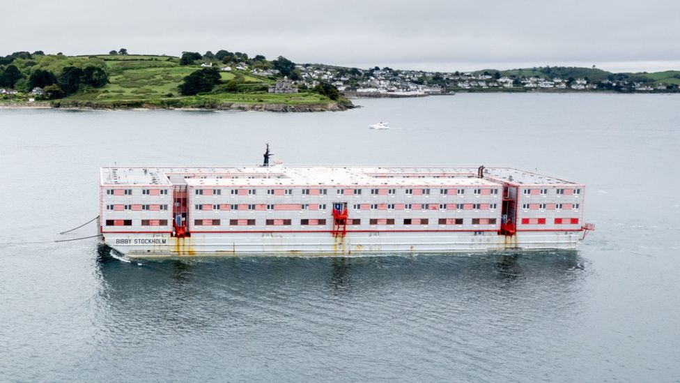 Bibby Stockholm: Controversial migrant barge arrives in Portland - BBC News