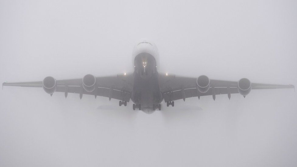 Flight delays after fog hits UK airports - BBC News