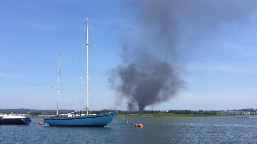 Waste fire burns at Poole industrial estate - BBC News