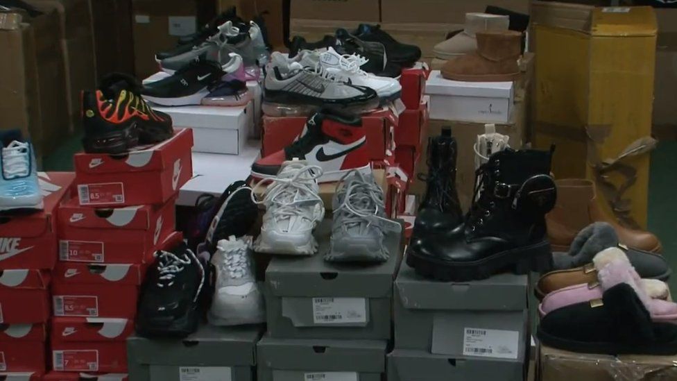 Police seize 20 tonnes of counterfeit goods in Manchester raids - BBC News